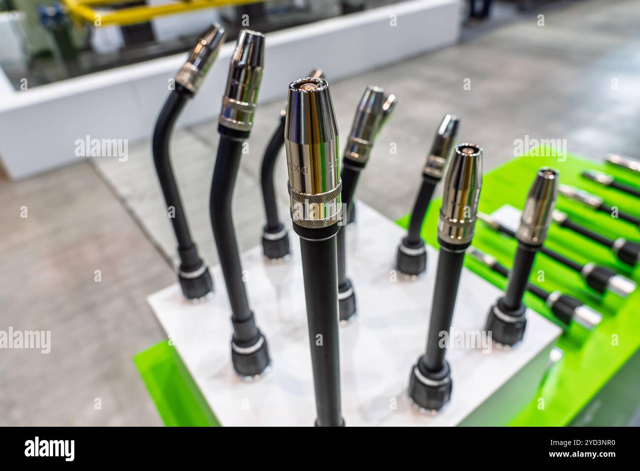 Robot welds steel. Welding head. Welding robot. CNC welding. Robotization and automation of the ...