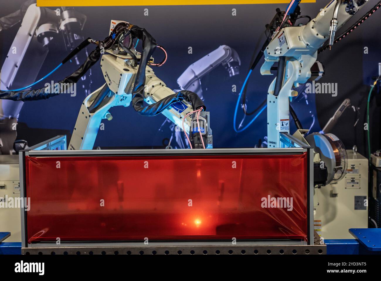 Robot welds steel. Welding head. Welding robot. CNC welding ...