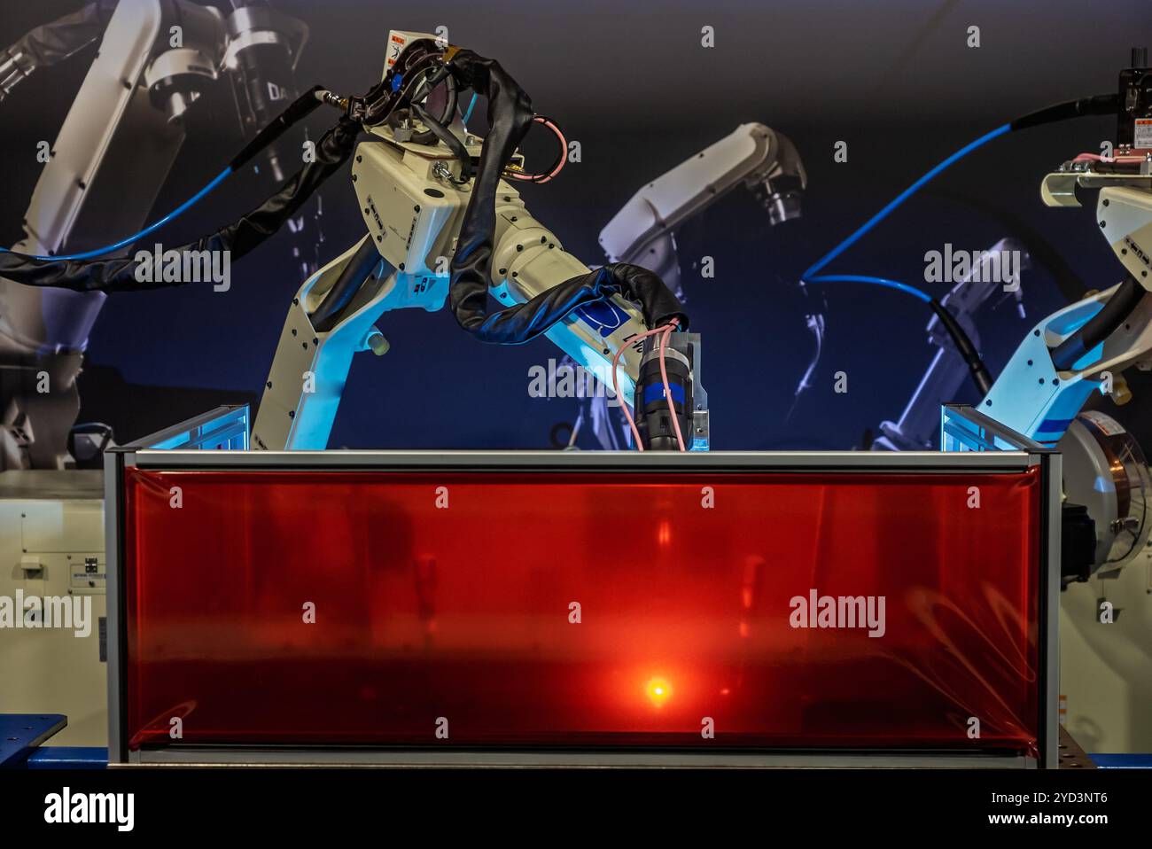 Robot welds steel. Welding head. Welding robot. CNC welding ...