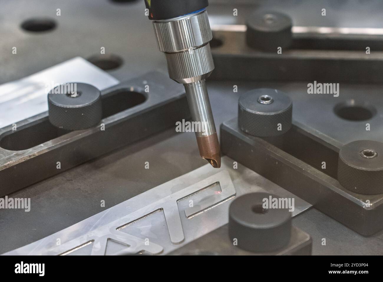 Robot welds steel. Welding head. Welding robot. CNC welding ...