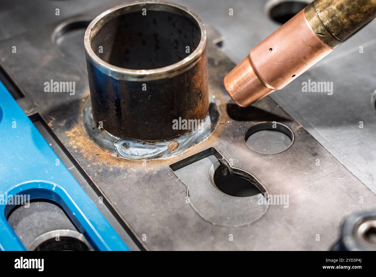 Robot welds steel. Welding head. Welding robot. CNC welding. Robotization and automation of the ...