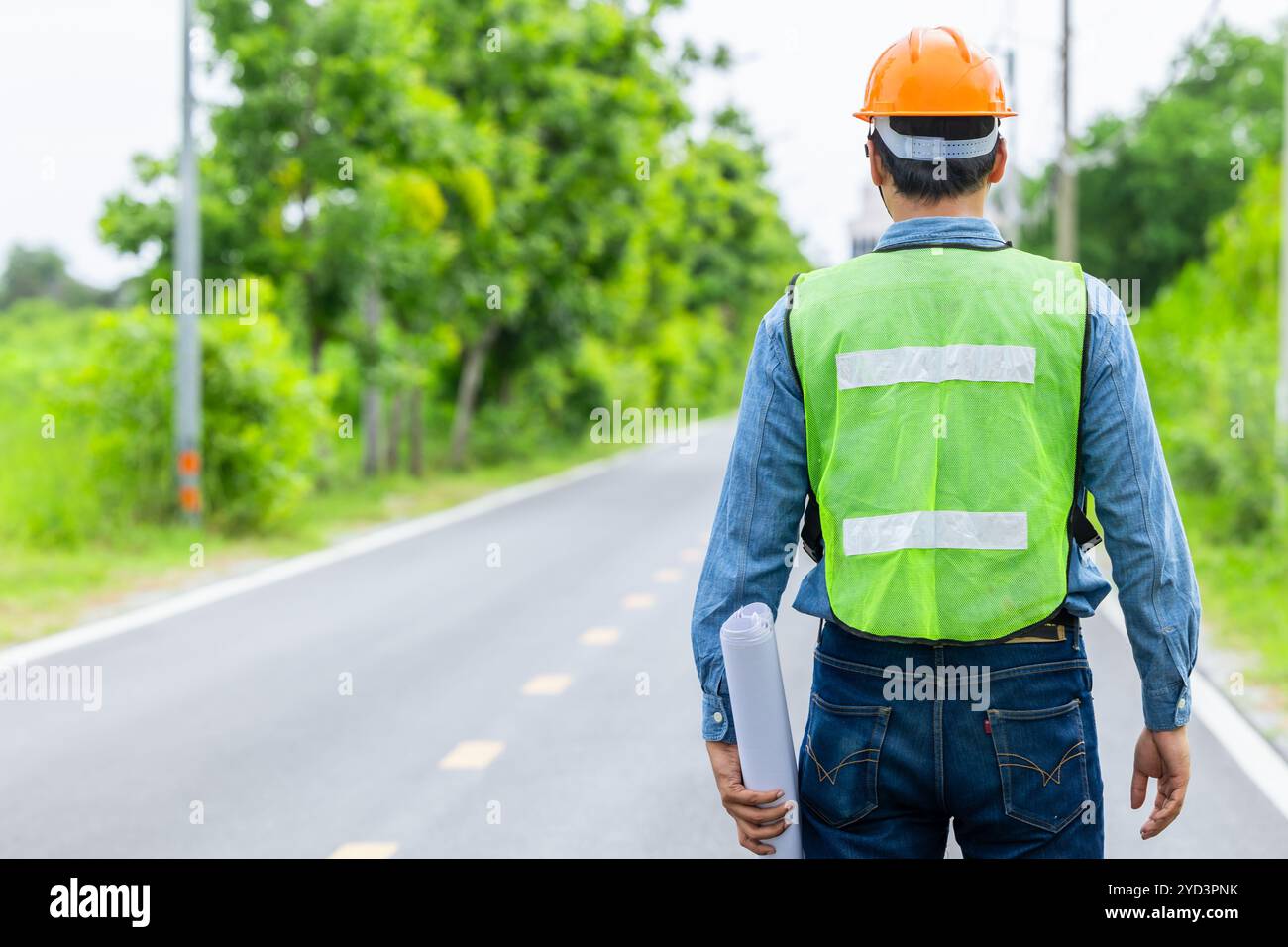 Engineer male road construction working with blueprint. finished ...