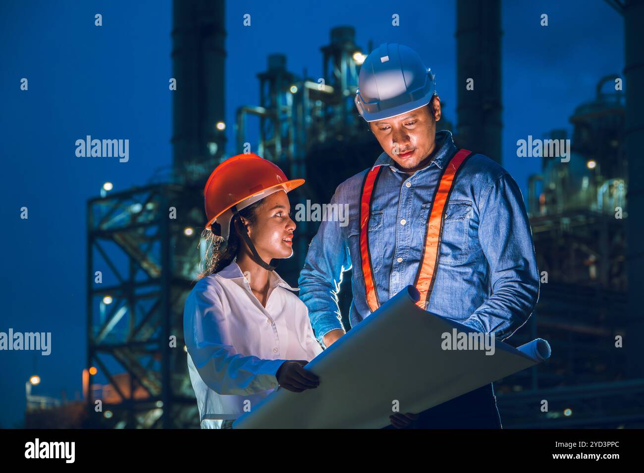 Petroleum refinery industry engineer night time working team. Power plant engineering workers ...