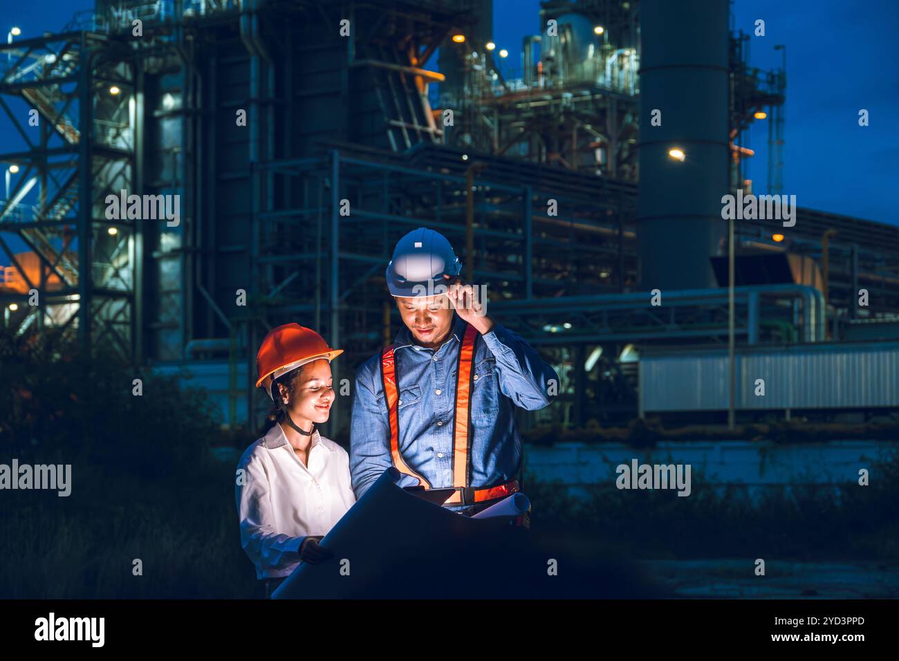 Petroleum refinery industry engineer night time working team. Power ...