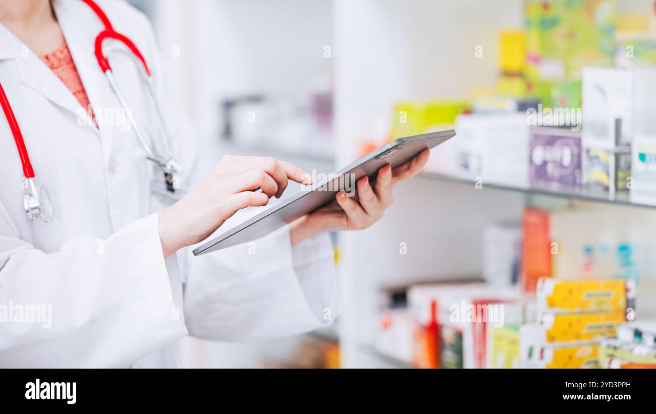 Pharmacist using online tablet checking drugs stock inventory in ...