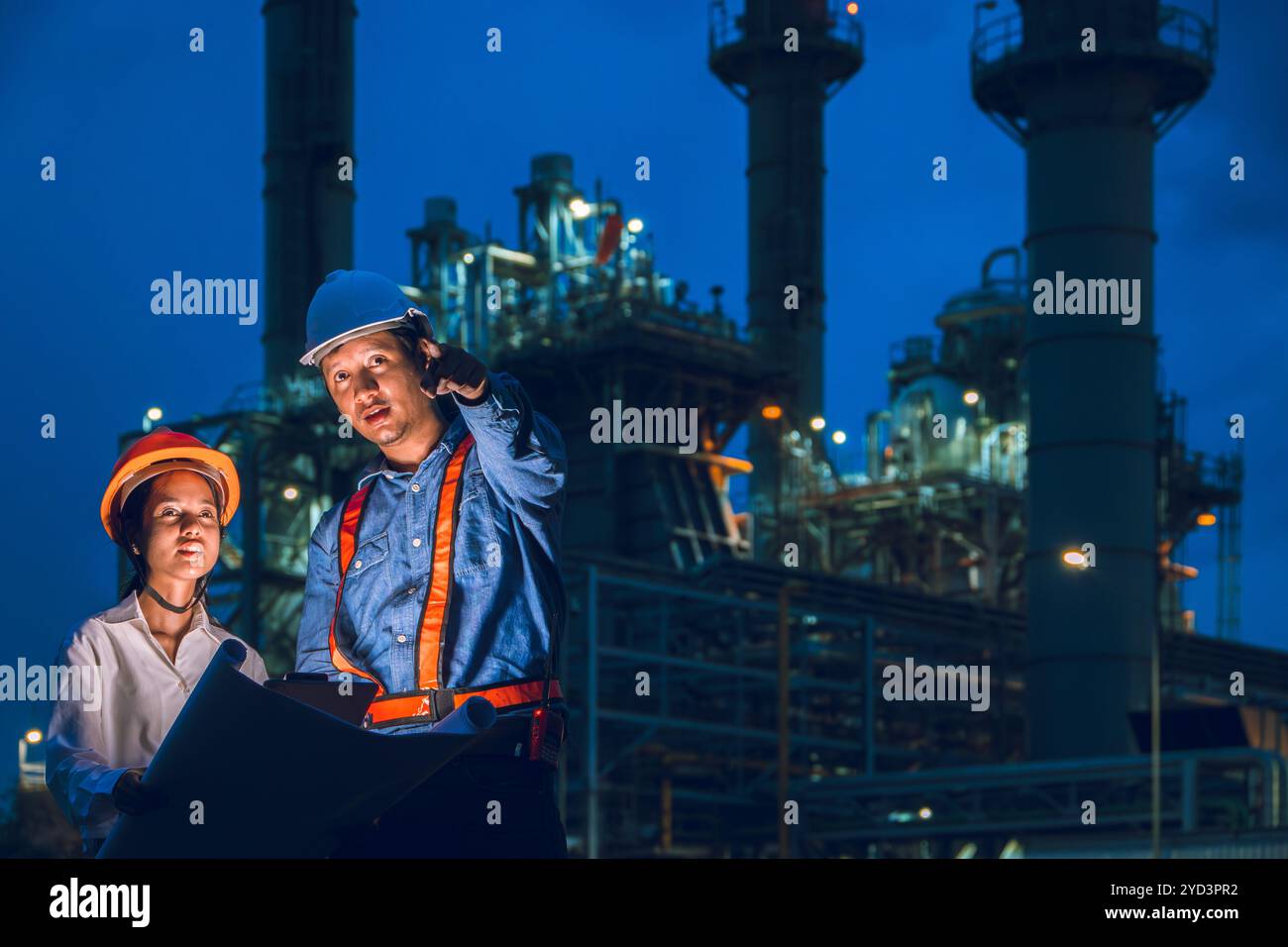 Petroleum refinery industry engineer night time working team. Power ...