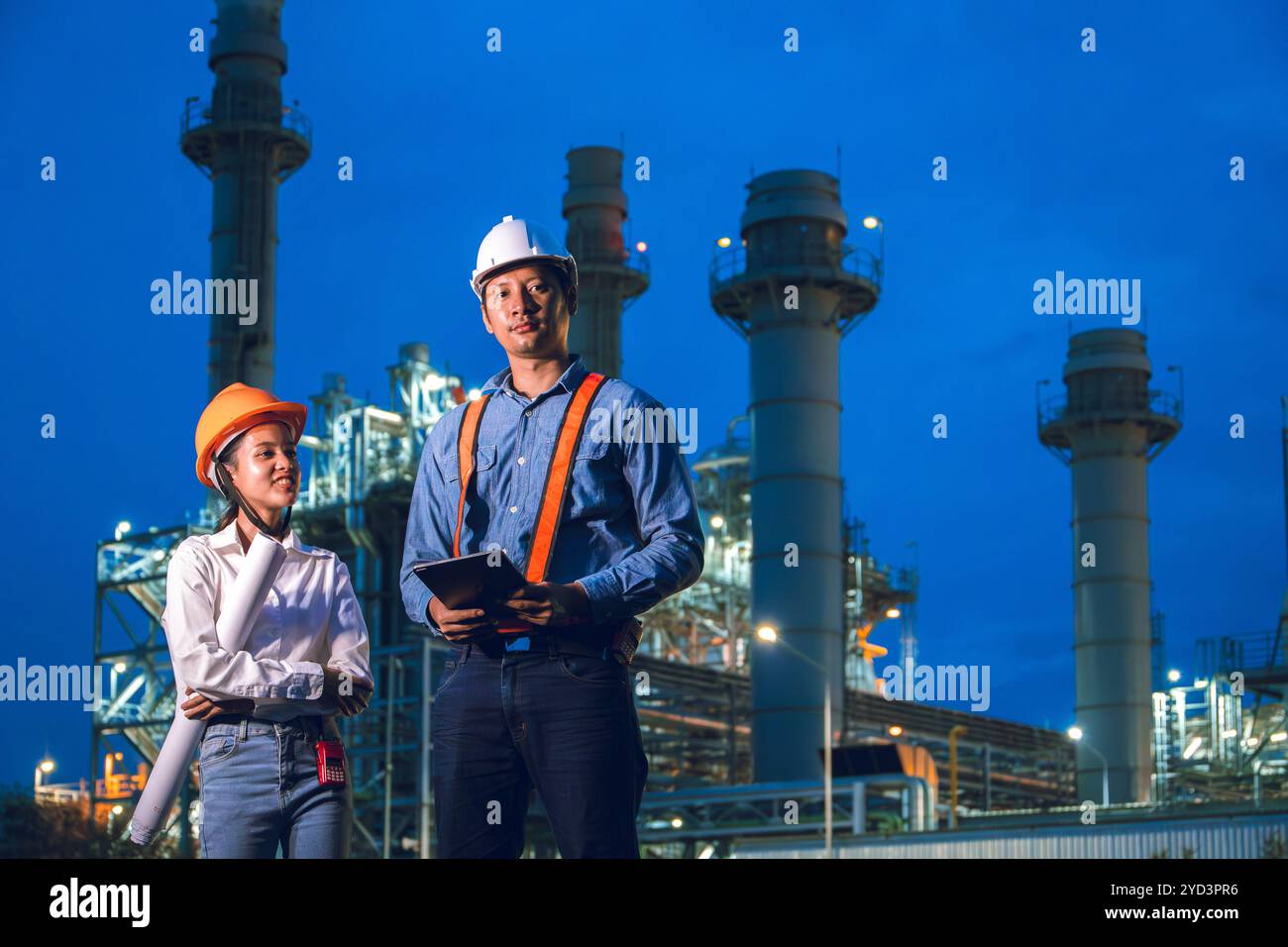 Petroleum refinery industry engineer team working standing together ...