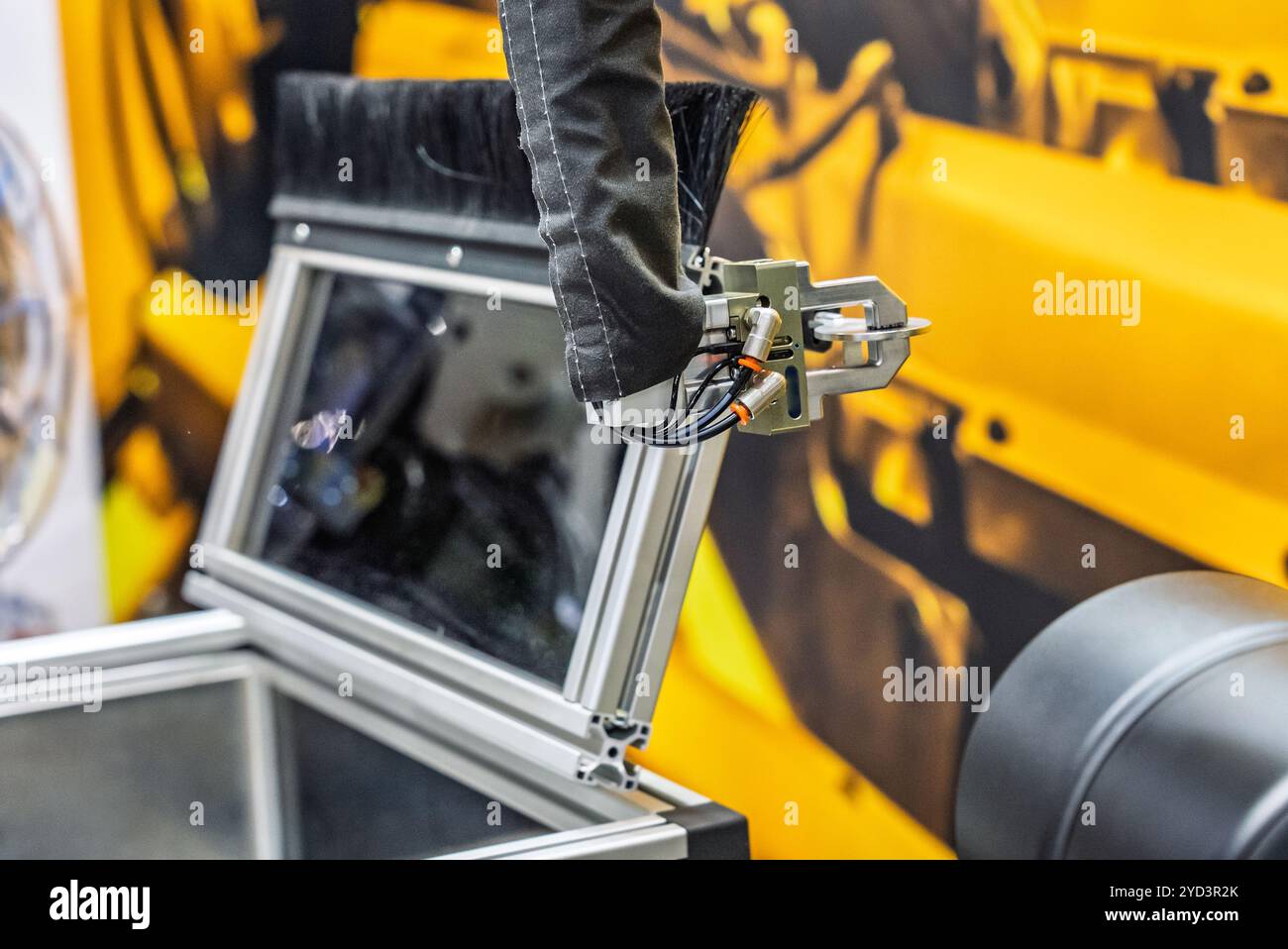Industrial robotics. Robot opens container. Robot arm opens and closes ...