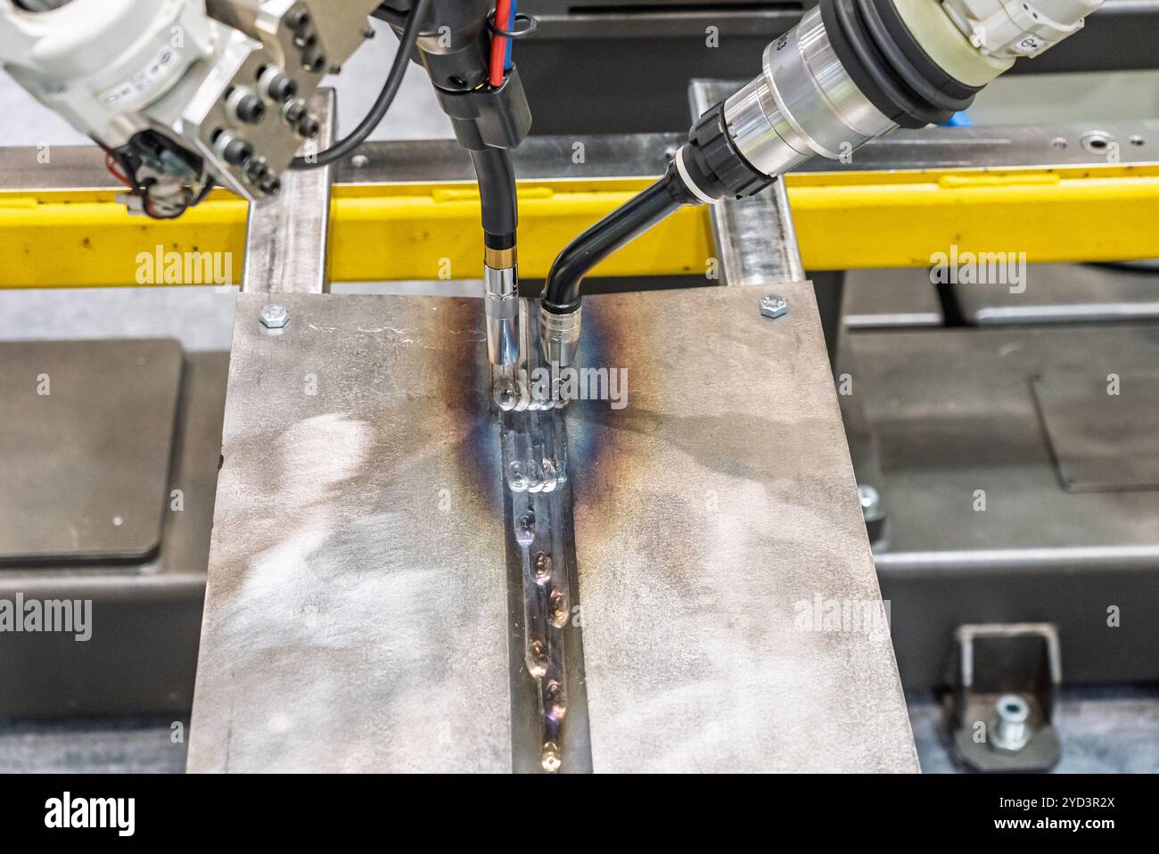 Robot welds steel. Welding head. Welding robot. CNC welding ...