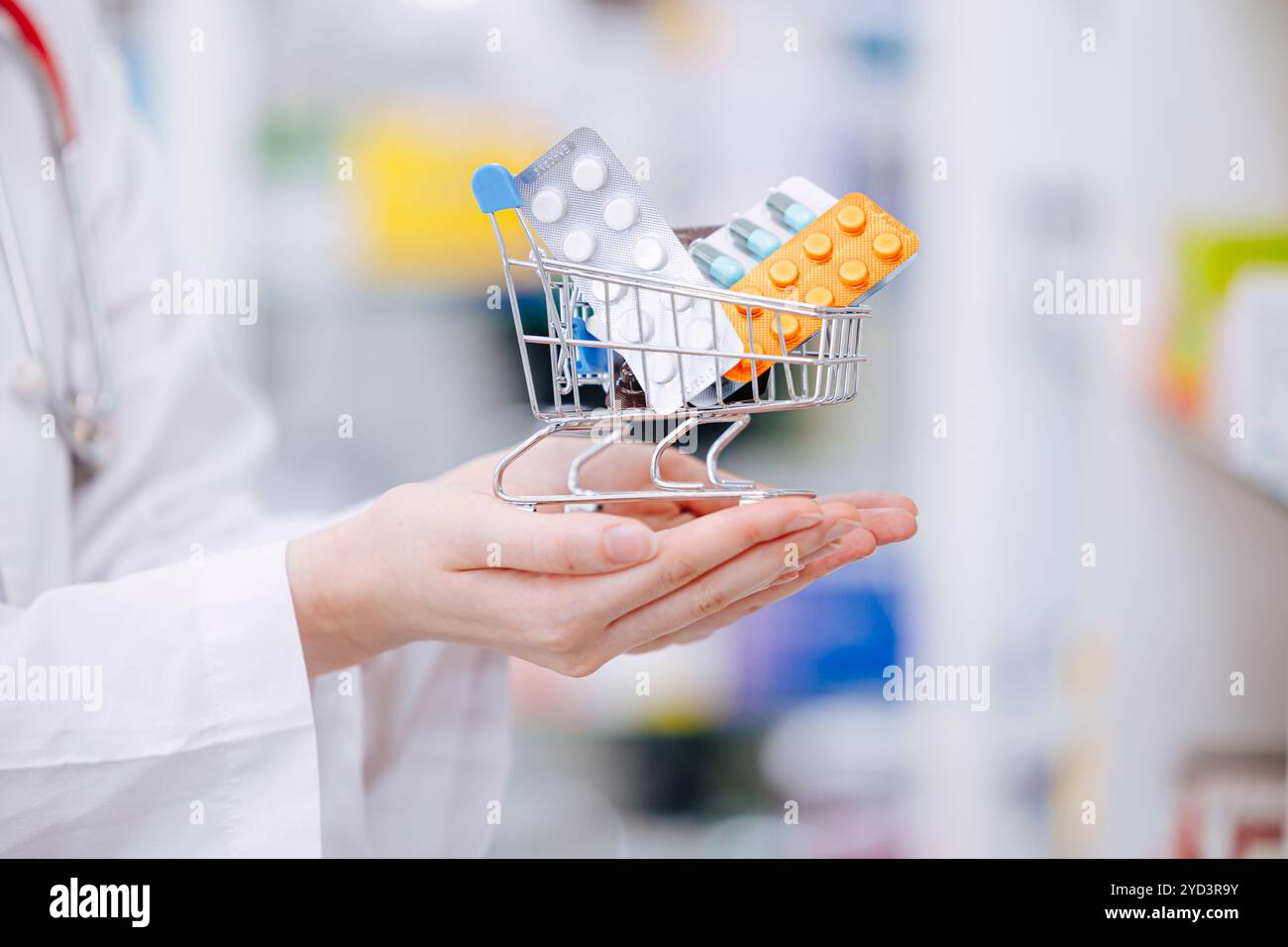 Doctor hand holding medicine pack set in shopping cart for medicine ...