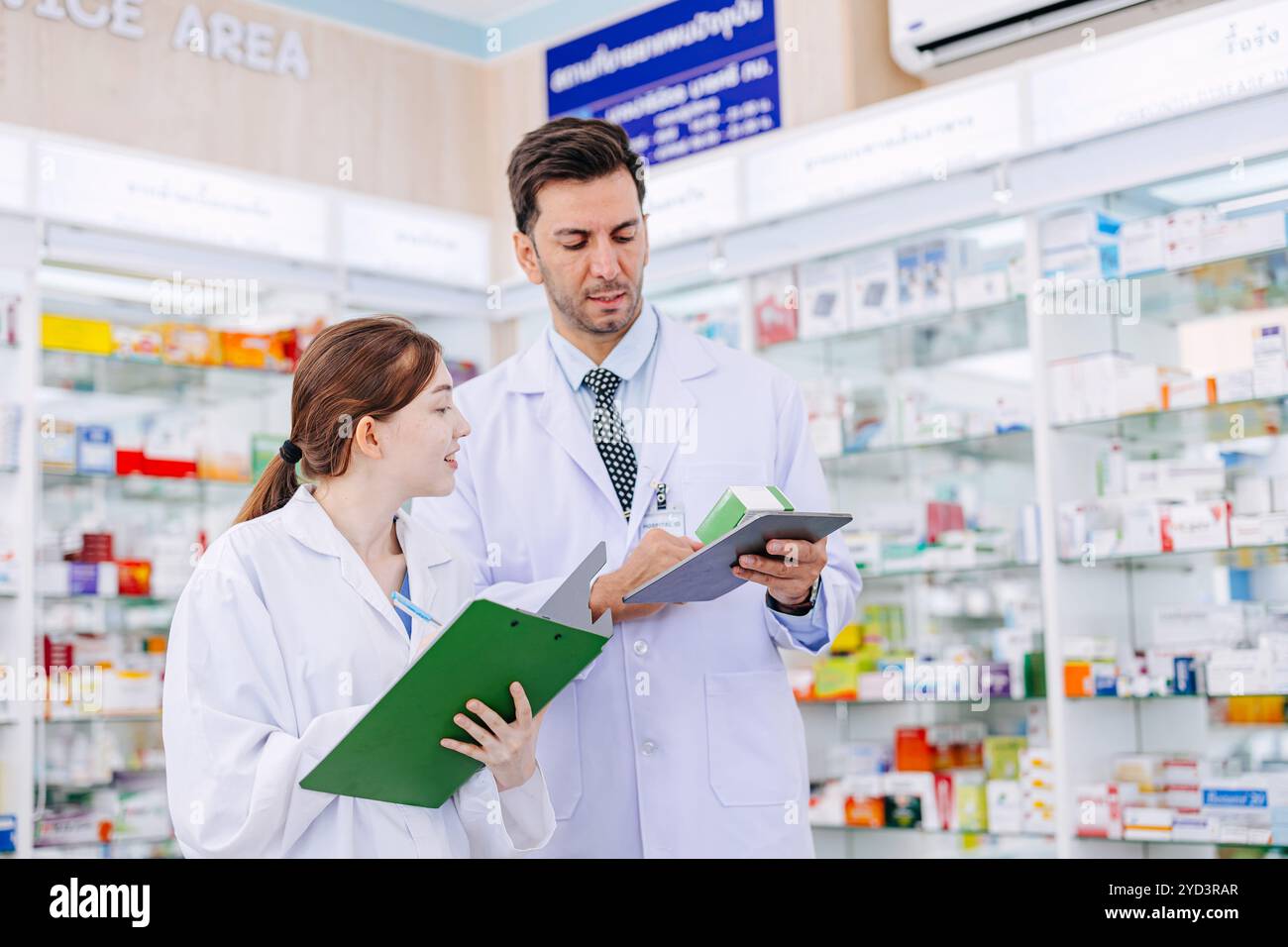 Pharmacy working people team stuff standing talking together in drugstore, Pharmacist male and ...