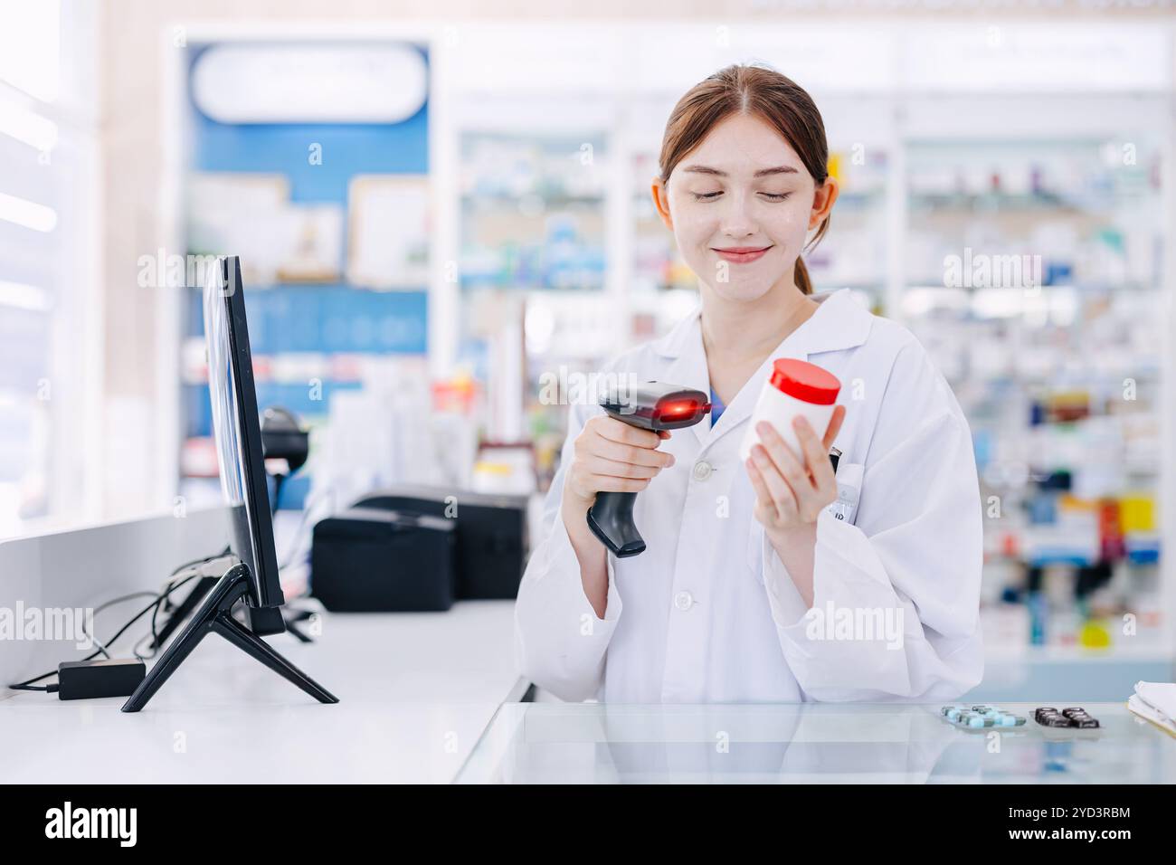 Pharmacist women at cashier medicine checkout, medical healthcare staff working in drugstore ...