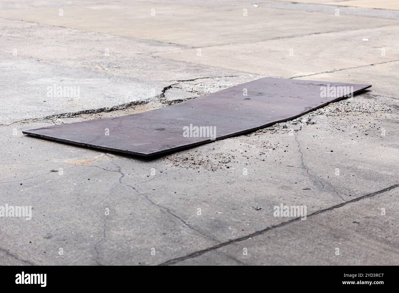 damaged concrete road surface temporary bad poor repair using thick ...