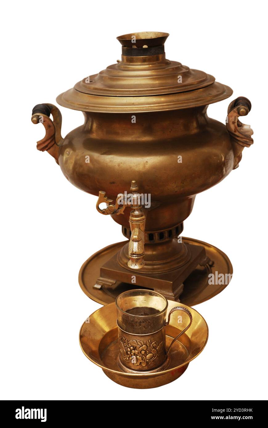 Traditional Russian brass samovar and a glass in a glass holder on ...
