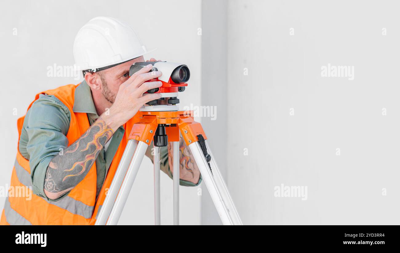engineer male builder surveyor team using laser leveling measure ...