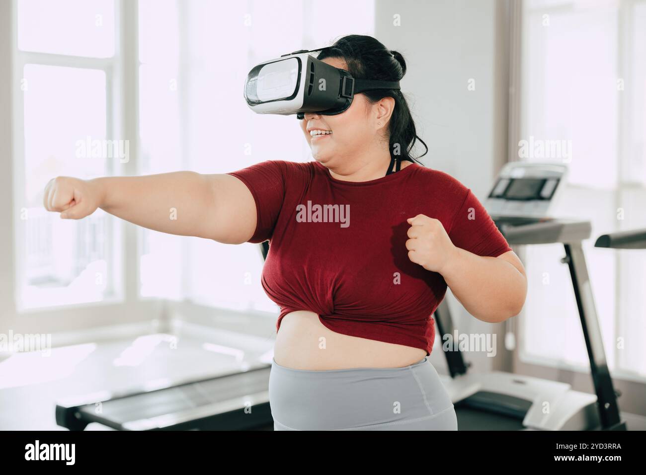 fat women with VR headset play visual reality sport game for exercise ...
