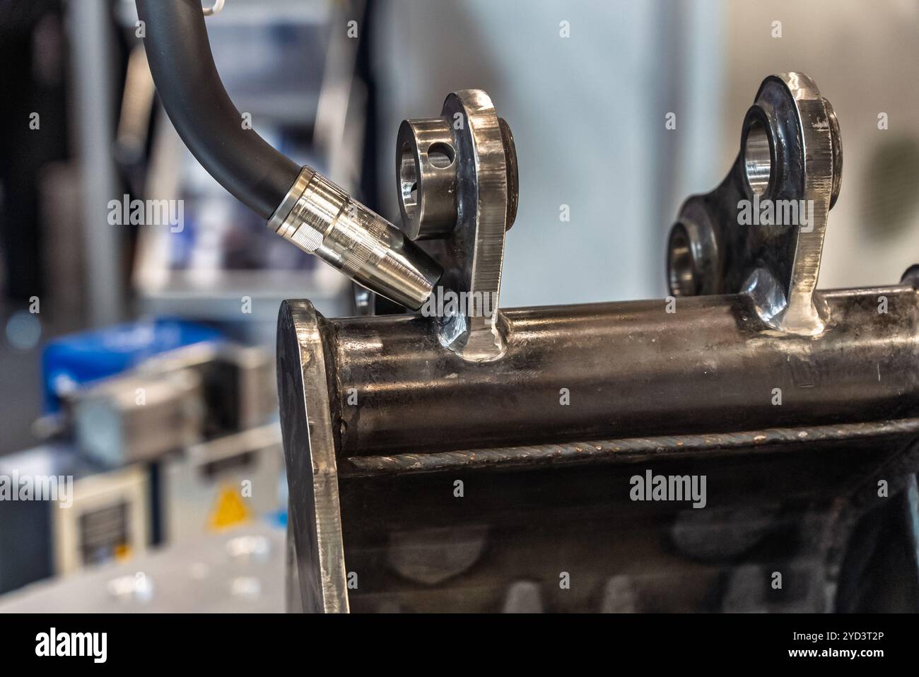 Robot welds steel. Welding head. Welding robot. CNC welding. Robotization and automation of the ...