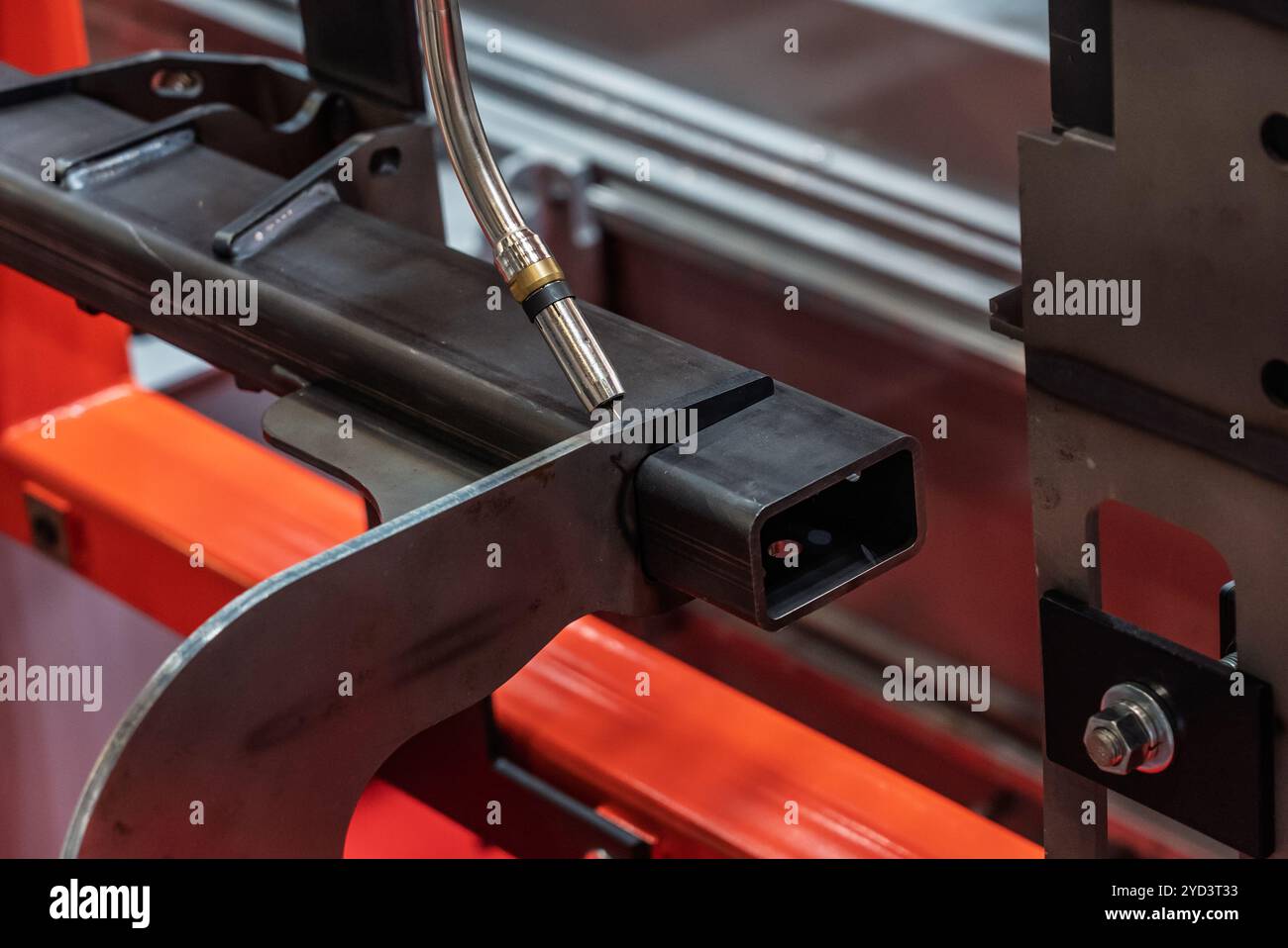 Robot welds steel. Welding head. Welding robot. CNC welding. Robotization and automation of the ...