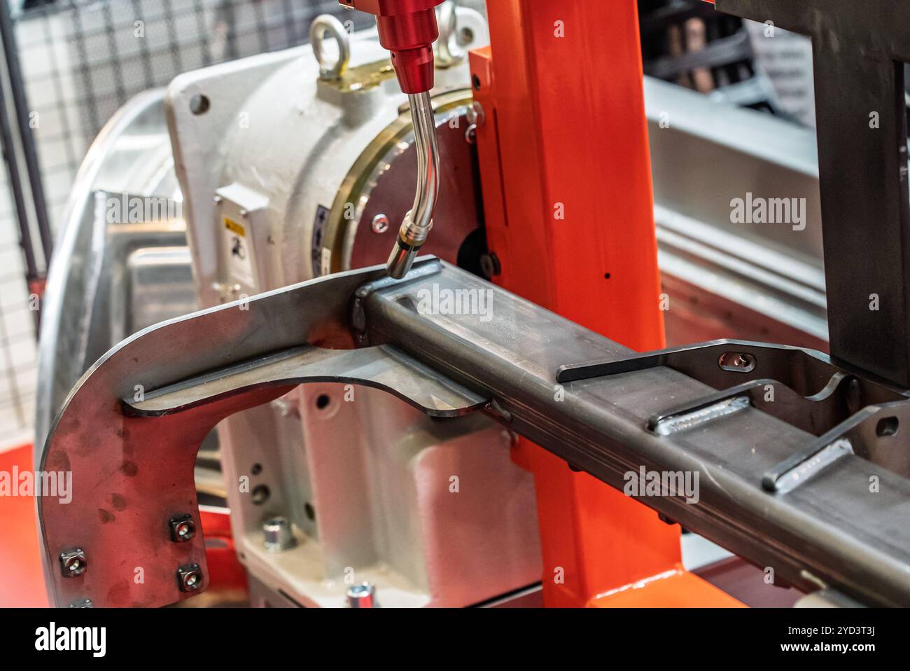 Robot welds steel. Welding head. Welding robot. CNC welding ...