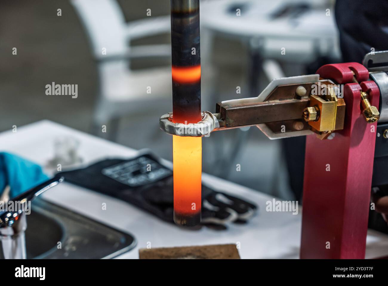 Induction hardening type of surface hardening . Metal part is induction ...