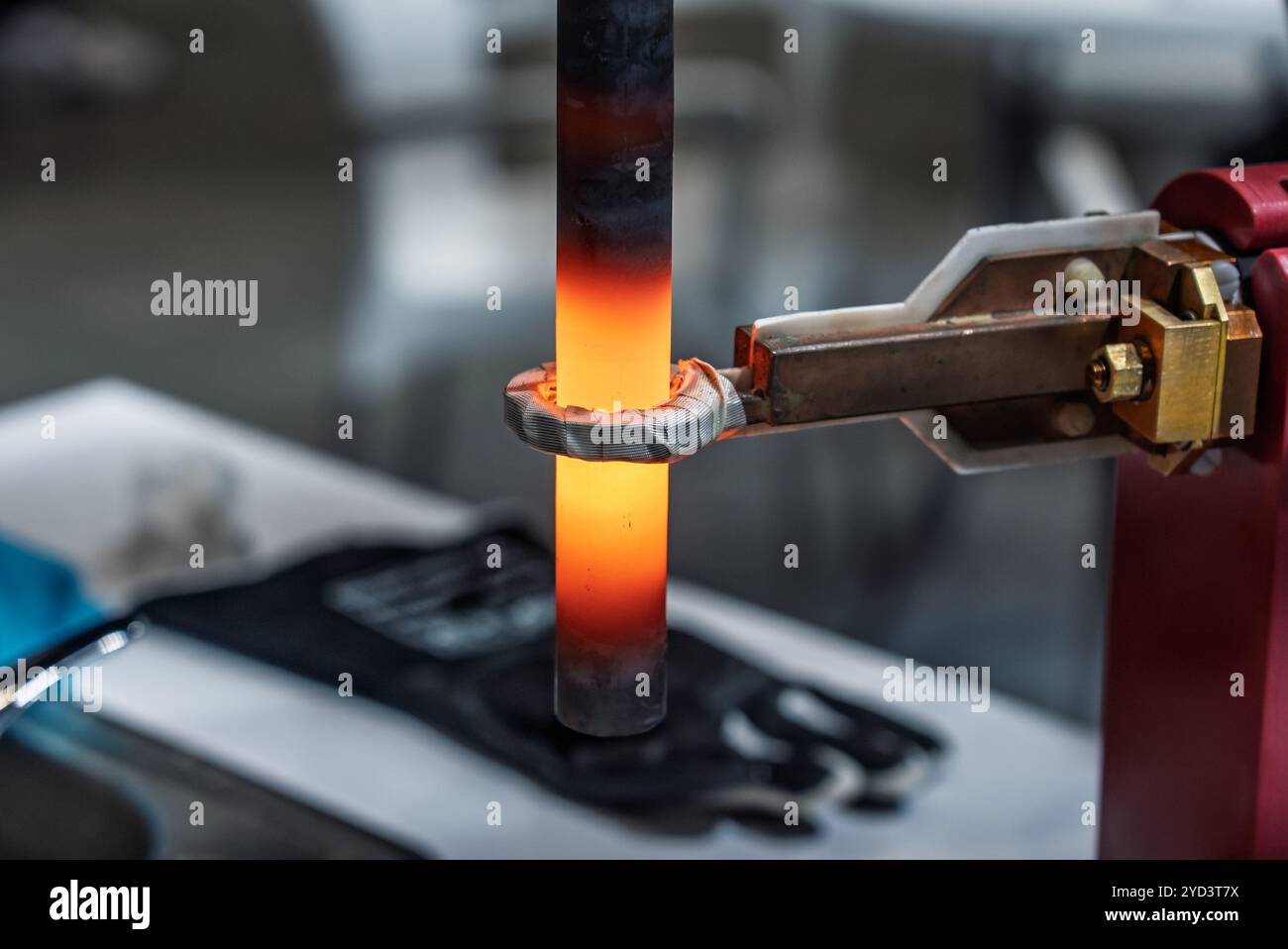 Induction hardening type of surface hardening . Metal part is induction ...