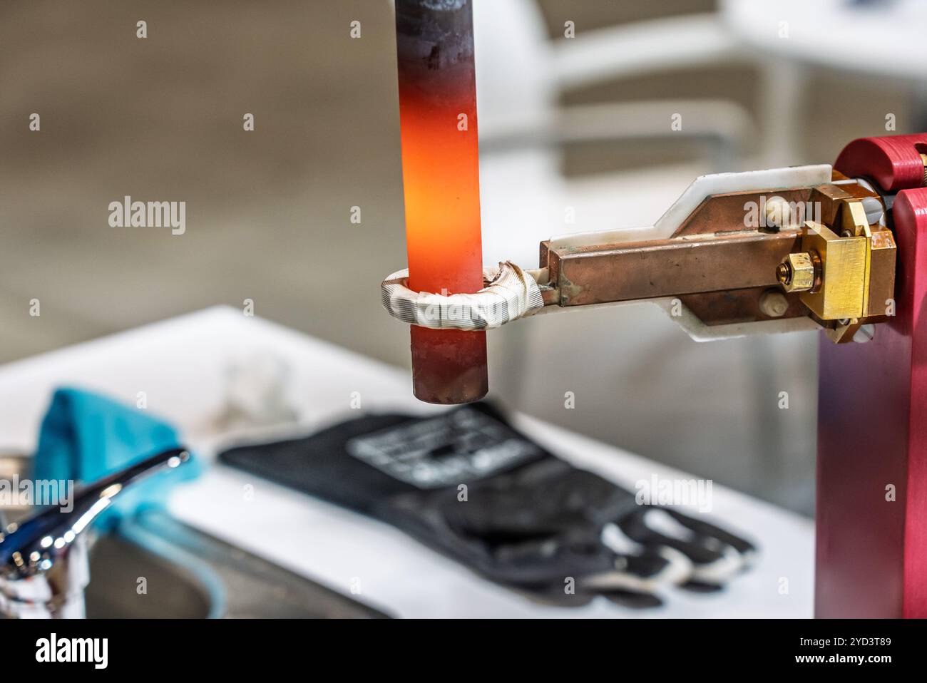 Induction hardening type of surface hardening . Metal part is induction ...