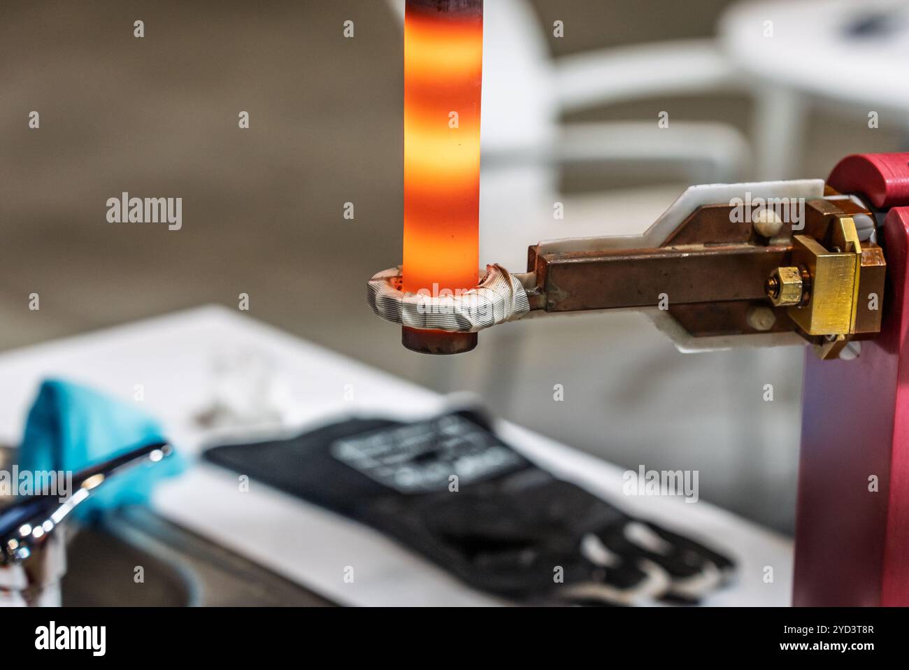 Induction hardening type of surface hardening . Metal part is induction ...
