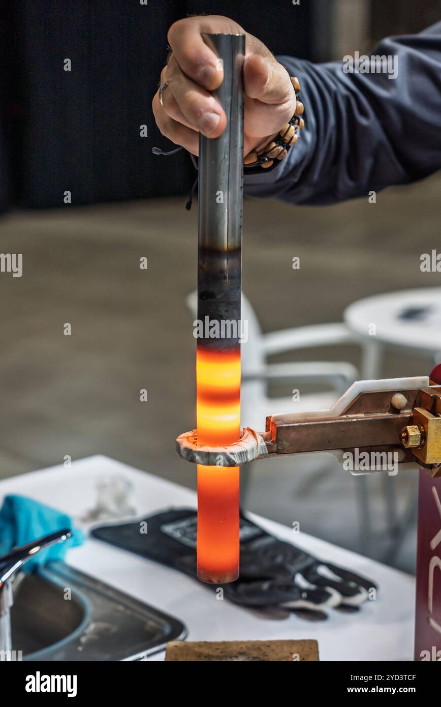 Induction hardening type of surface hardening . Metal part is induction ...