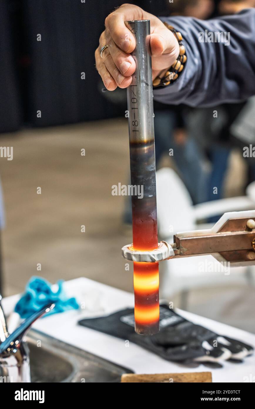 Induction hardening type of surface hardening . Metal part is induction ...