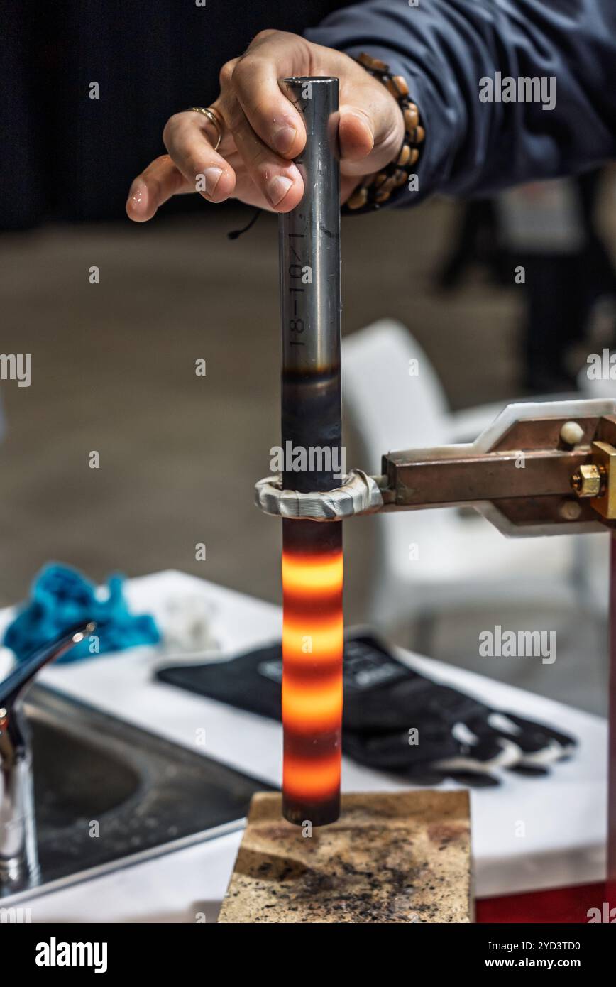 Induction hardening type of surface hardening . Metal part is induction ...