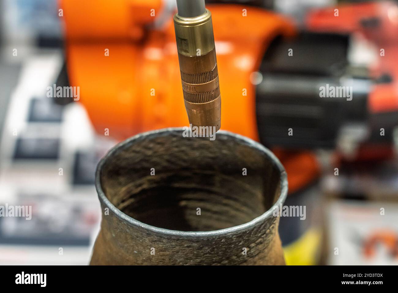 Robot welds steel. Welding head. Welding robot. CNC welding ...