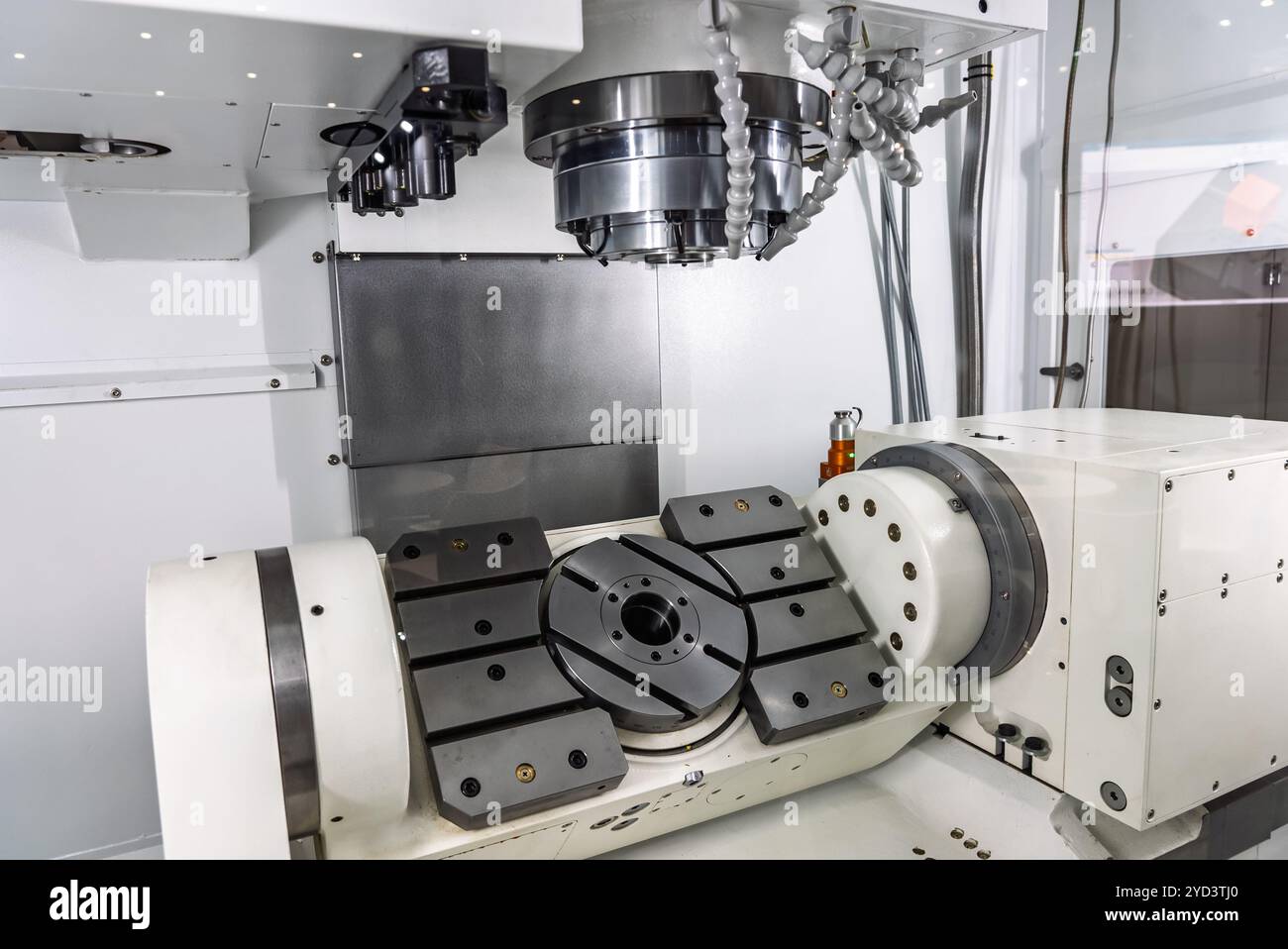 Milling machine with a rotary table. Multi axis CNC machine. Five-axis milling machining center ...