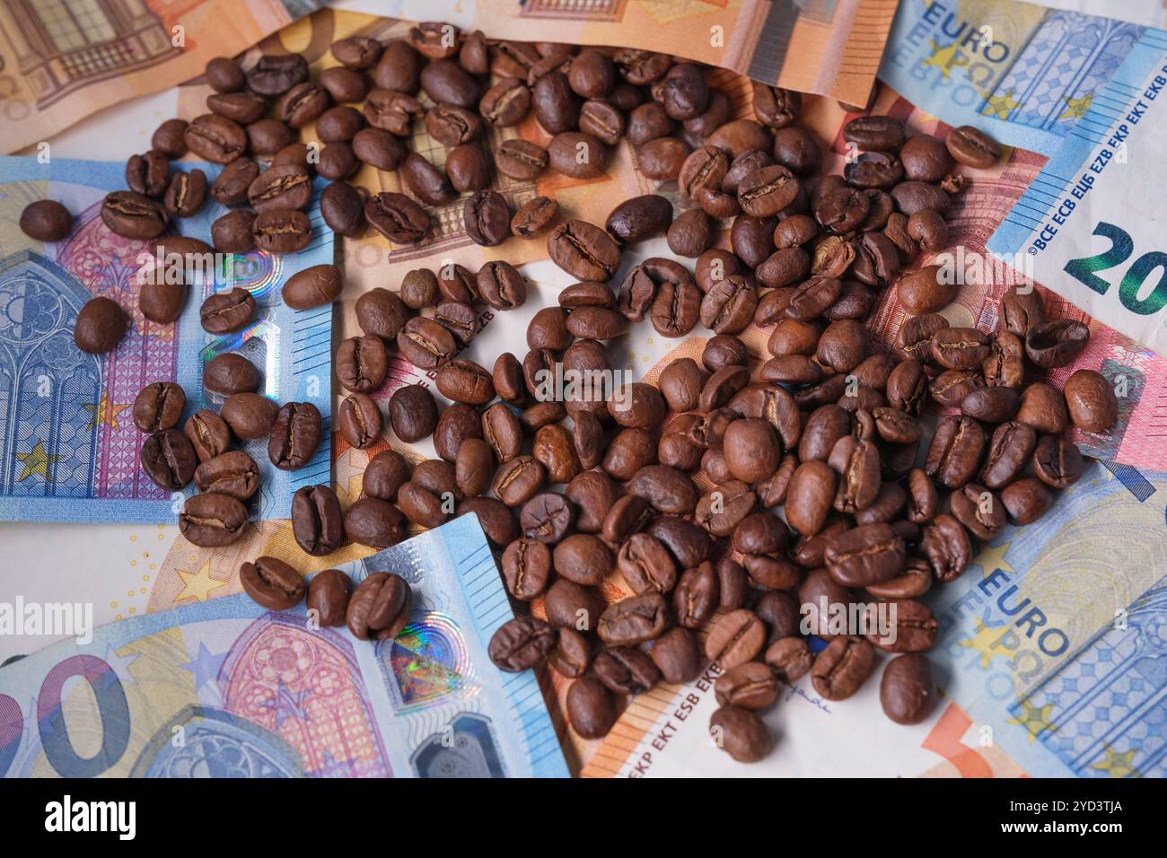 Coffee beans on euro banknotes Stock Photo - Alamy