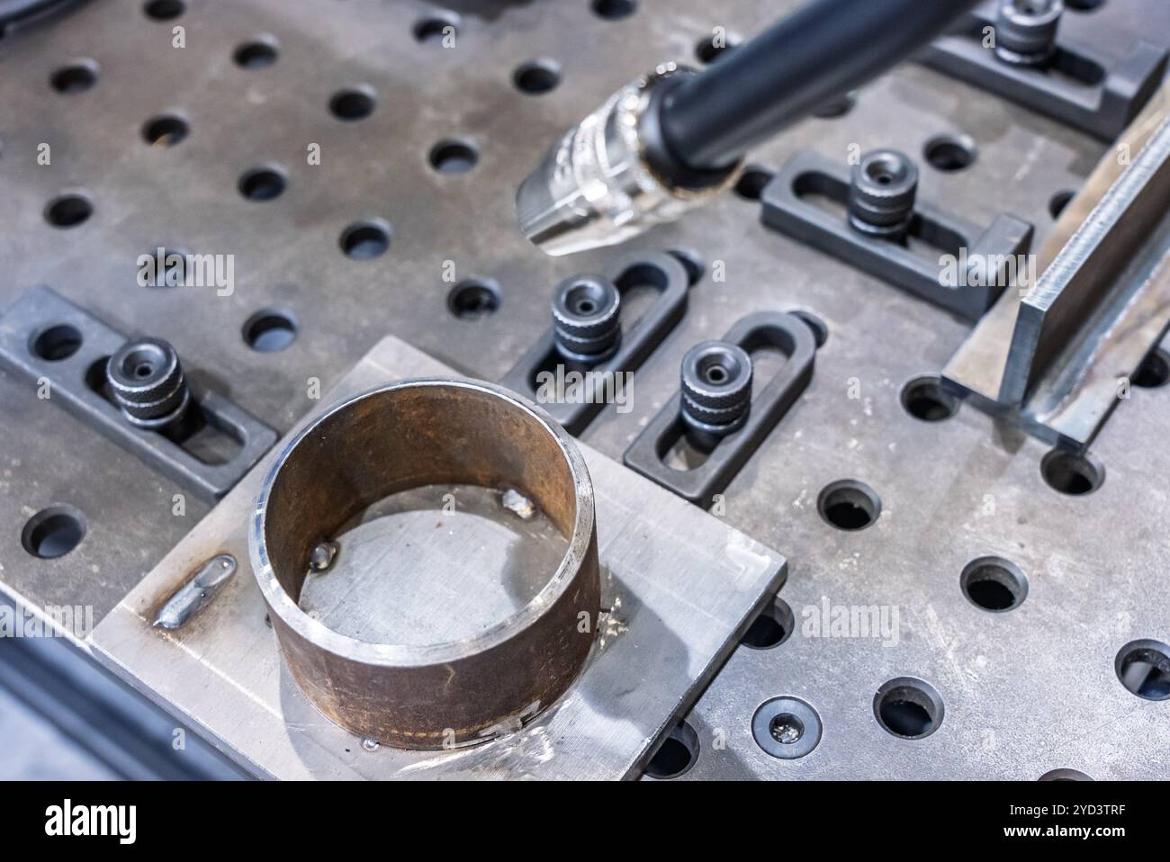 Robot welds steel. Welding head. Welding robot. CNC welding ...