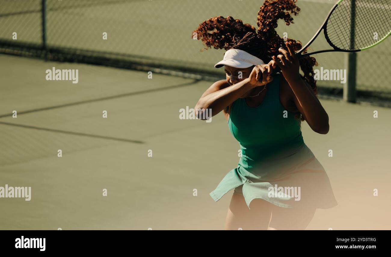 Female tennis player showcasing powerful forehand stroke in action ...