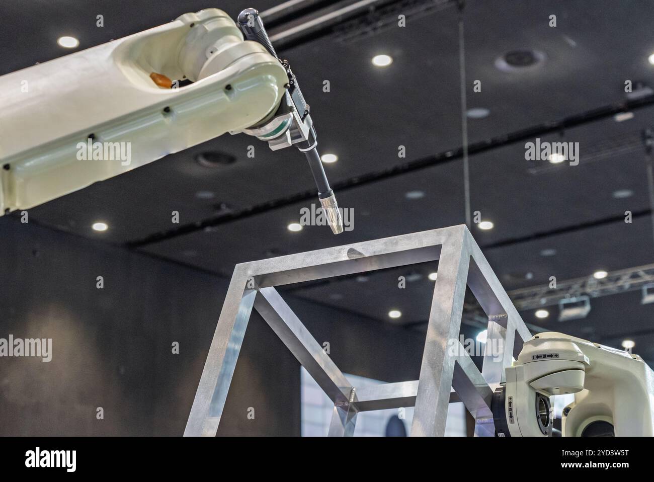 Robot welds steel. Welding head. Welding robot. CNC welding ...