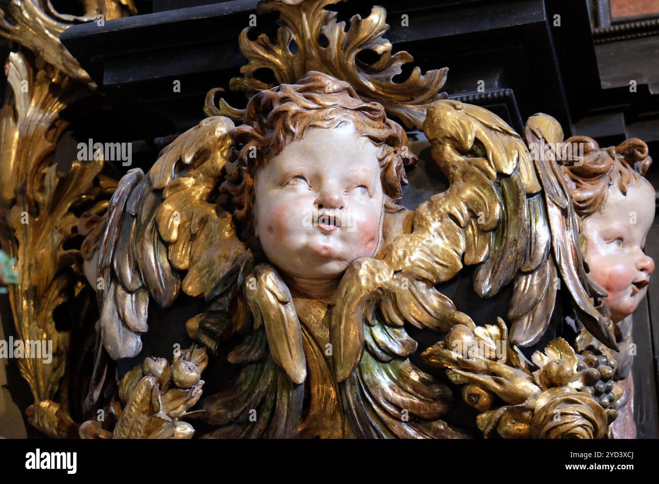 Angel on the altar of the Holy Rosary in Parish church in St. Wolfgang ...