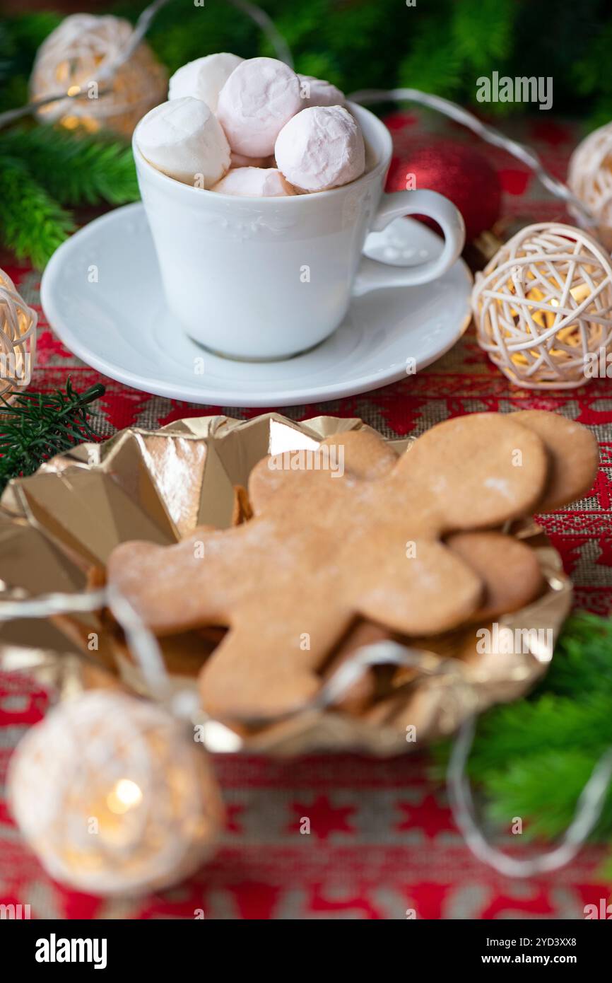 Festive Christmas scene featuring a white cup filled with hot chocolate ...