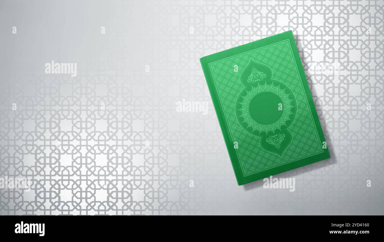 The holy book of Al Quran sitting on abstract white geometric pattern ...