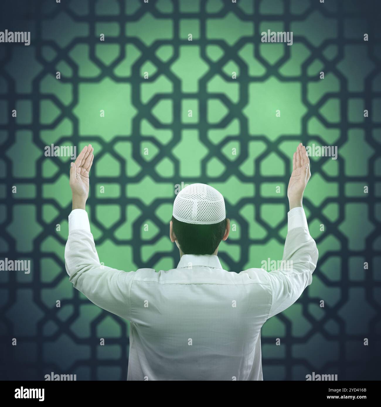 Religious Muslim man praying while raised hands with abstract green ...