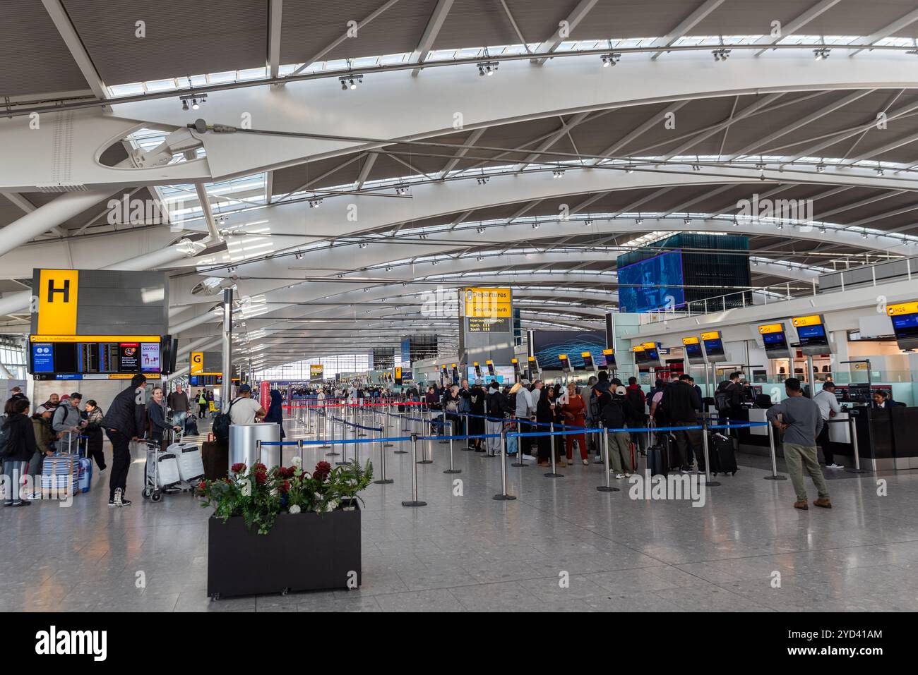 Inside Terminal 5 departures at London Heathrow Airport, UK. Passengers ...