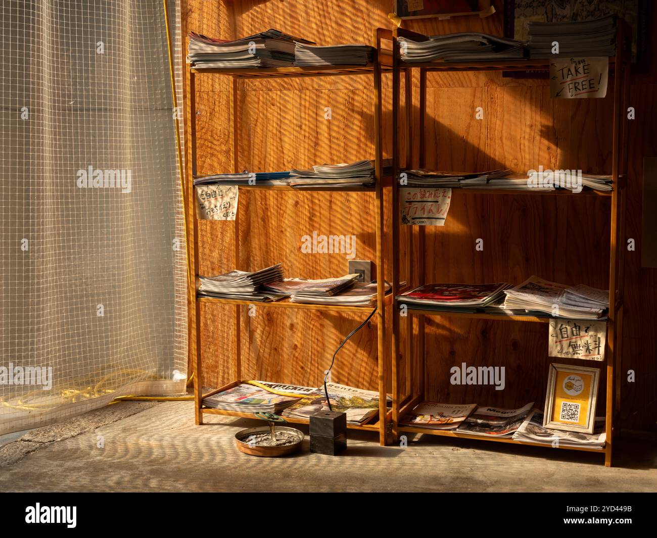 A bookshelf with magazines in a cafe in Kyoto, Japan Stock Photo - Alamy