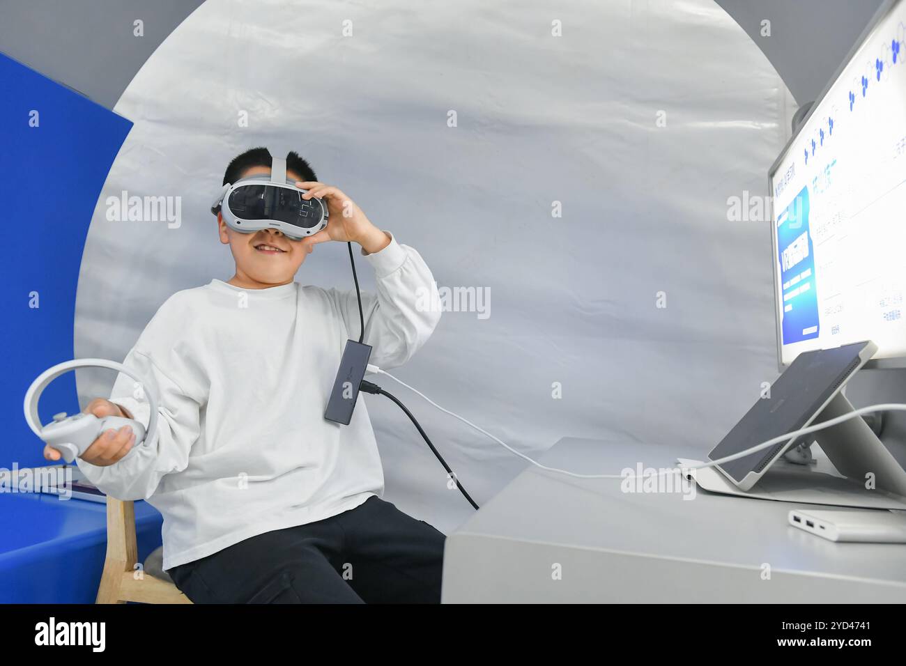 HEFEI, CHINA - OCTOBER 24, 2024 - A child experiences a VR interstellar ...