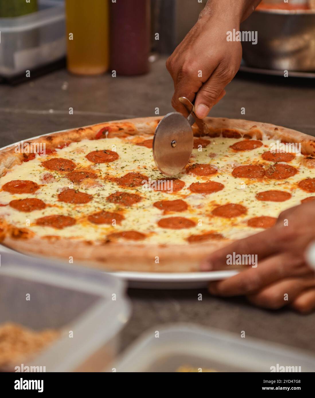 Italian thin crust pizza with spicy salami and mozzarella Stock Photo ...