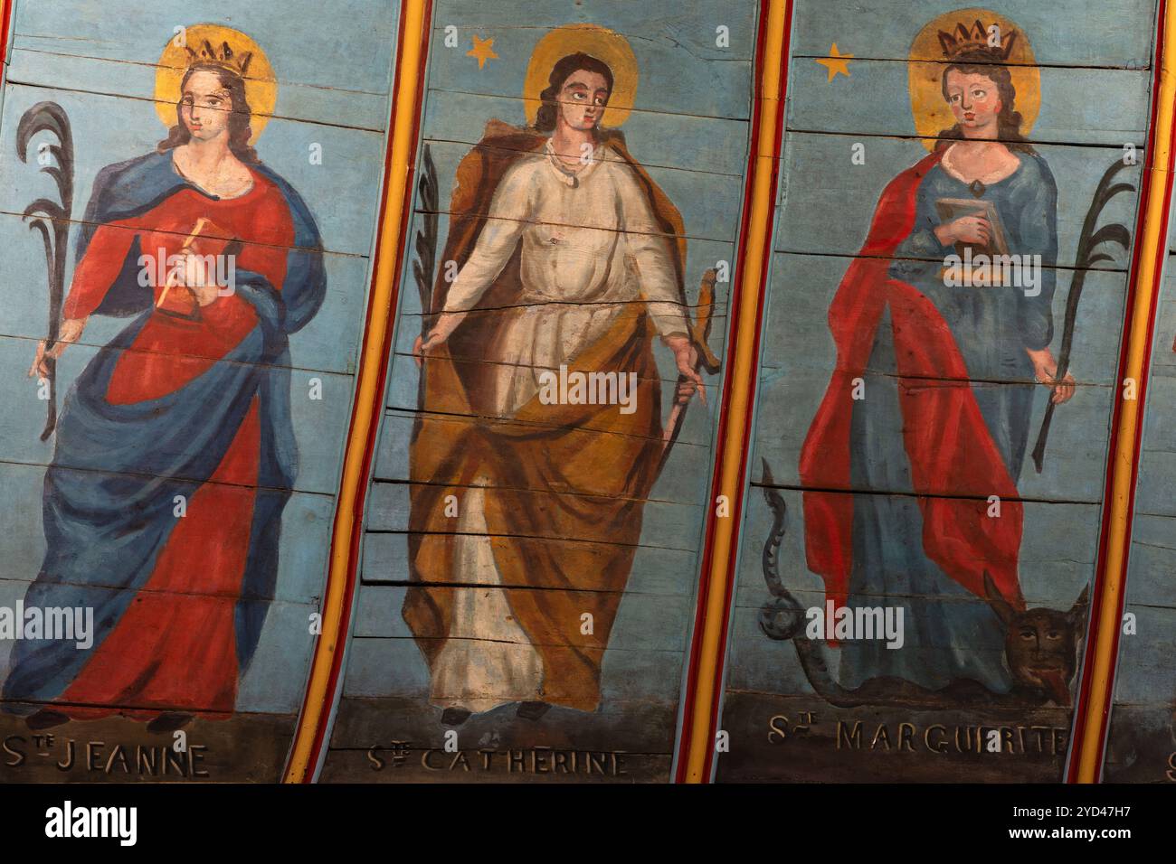 Three female saints, each holding a martyr’s palm frond: Joan of Arc ...