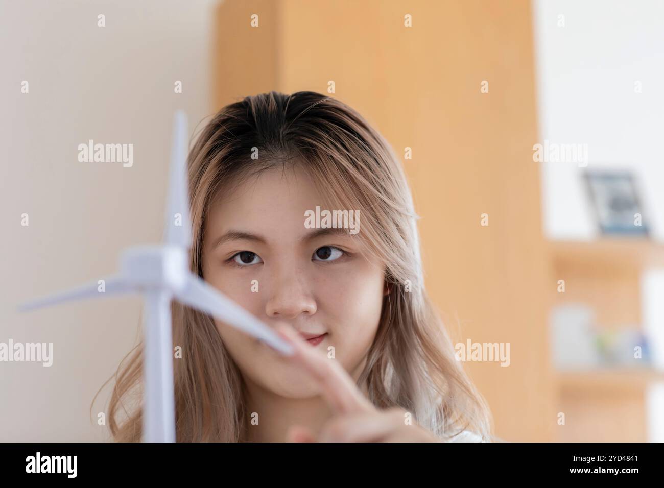 Young chinese woman playing with windmill Stock Photo - Alamy