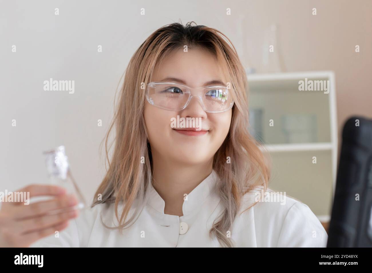 Young chinese scientist female working with sample Stock Photo - Alamy