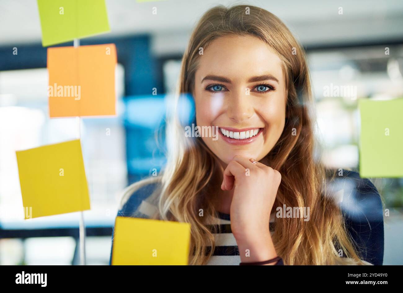 Portrait, business and woman with notes on glass wall for planning ...