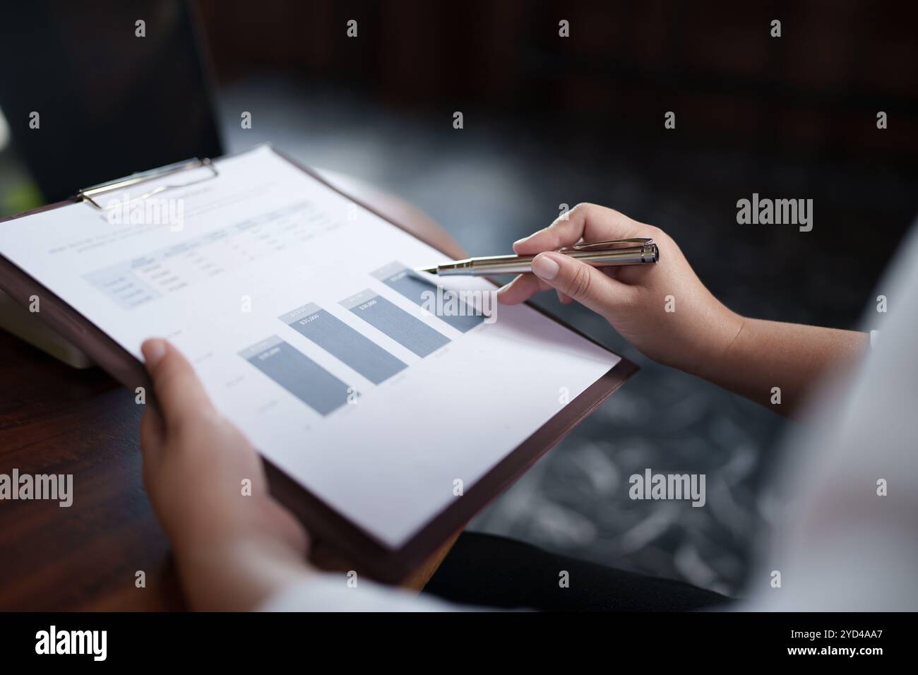 Business woman analyzing data paperwork calculating numbers Stock Photo ...