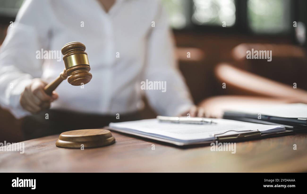 Auction concept, Hand holding auction hammer Stock Photo - Alamy